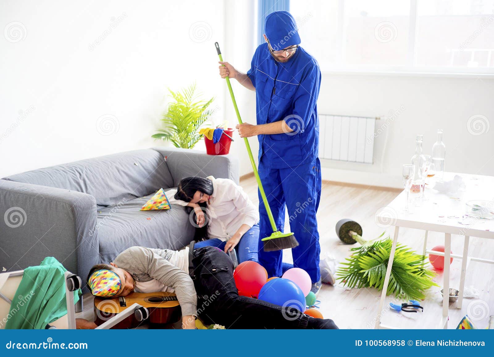 Janitor cleaning a mess stock photo. Image of indoors - 100568958