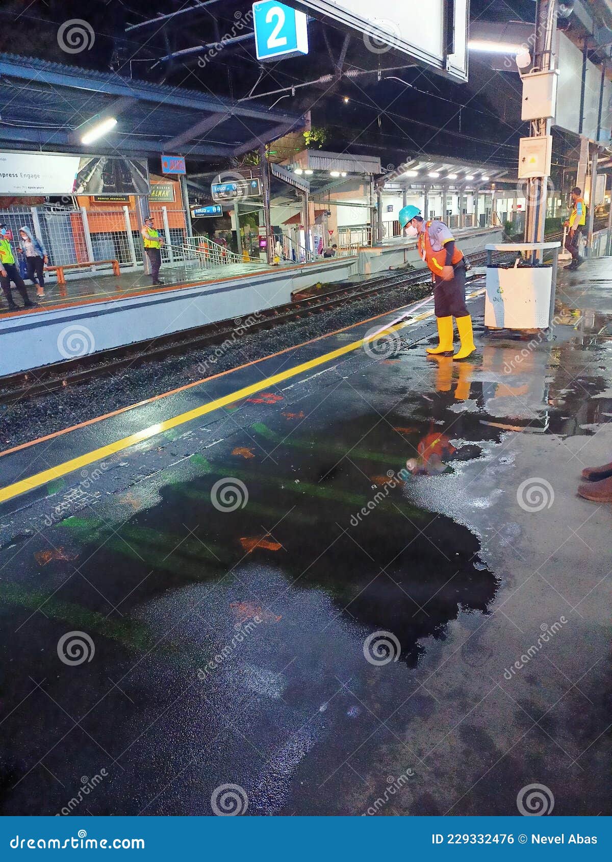 Janitor is Draining Puddle of Water at Jakarta Train Station Editorial ...
