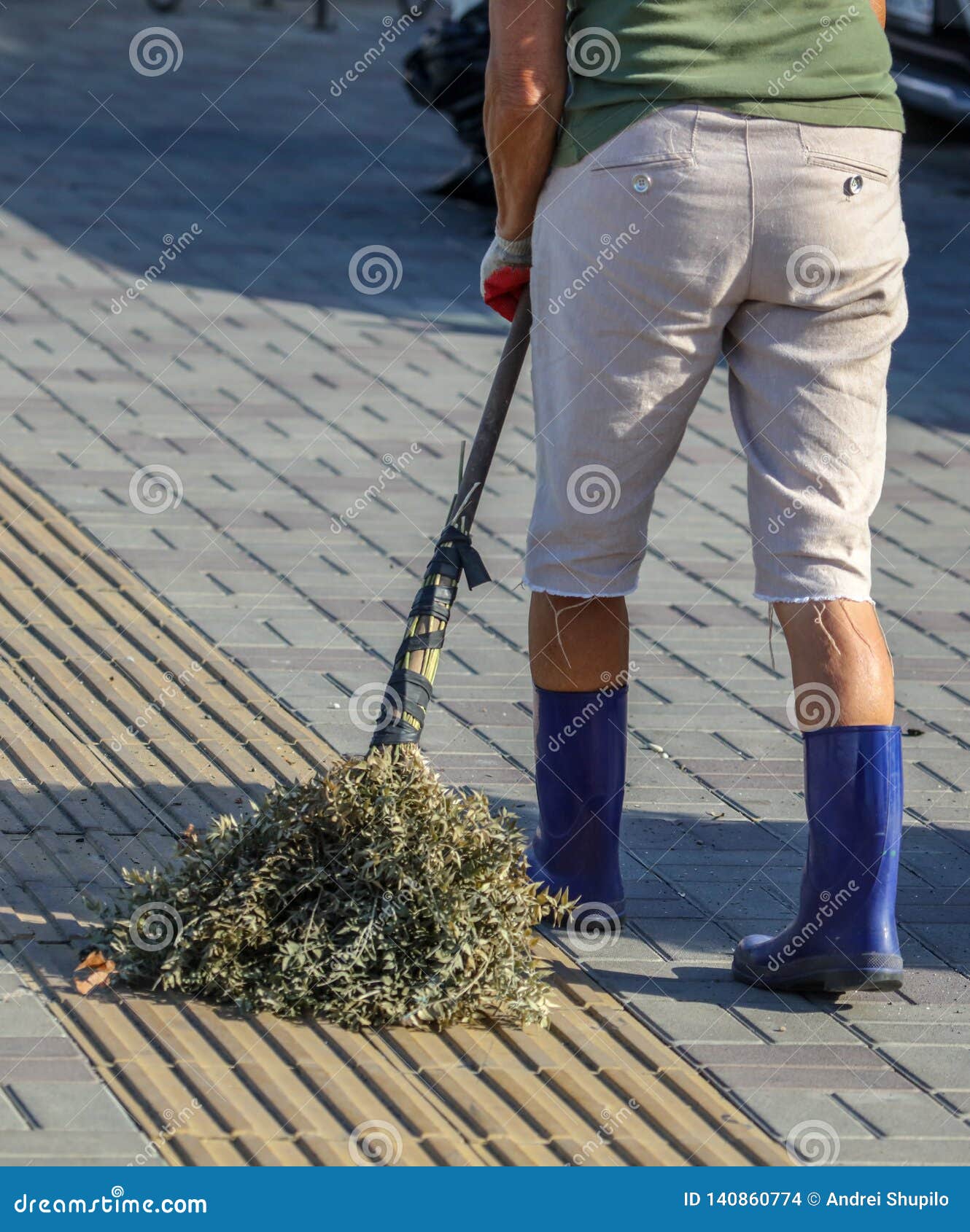 Janitor Sweeps the Road with a Broom Stock Photo - Image of garbage ...