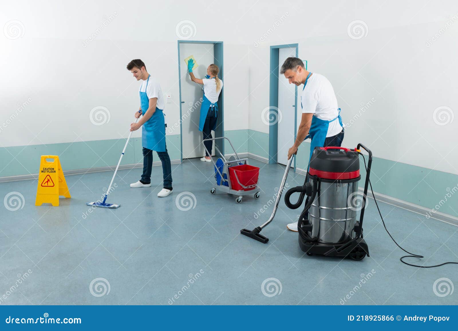 Janitors Cleaning Corridor stock photo. Image of manual - 218925866