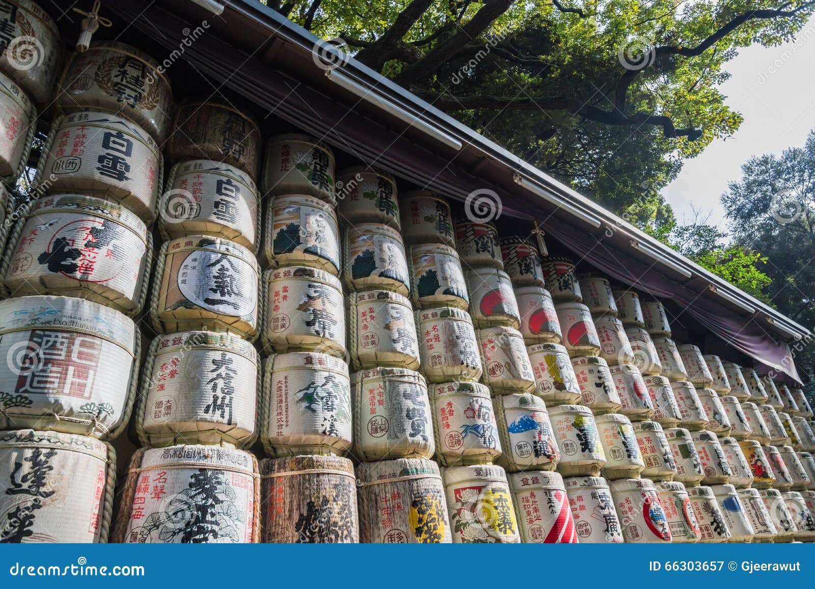 Japanese Barrels of Sake Wrapped in Straw Stacked on Shelf Editorial ...