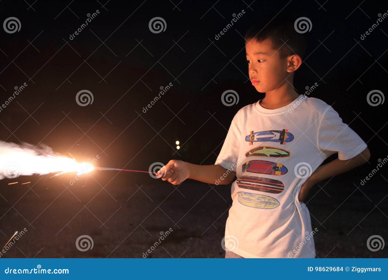Japanese Boy Doing Handheld Fireworks Stock Photo - Image of dark ...