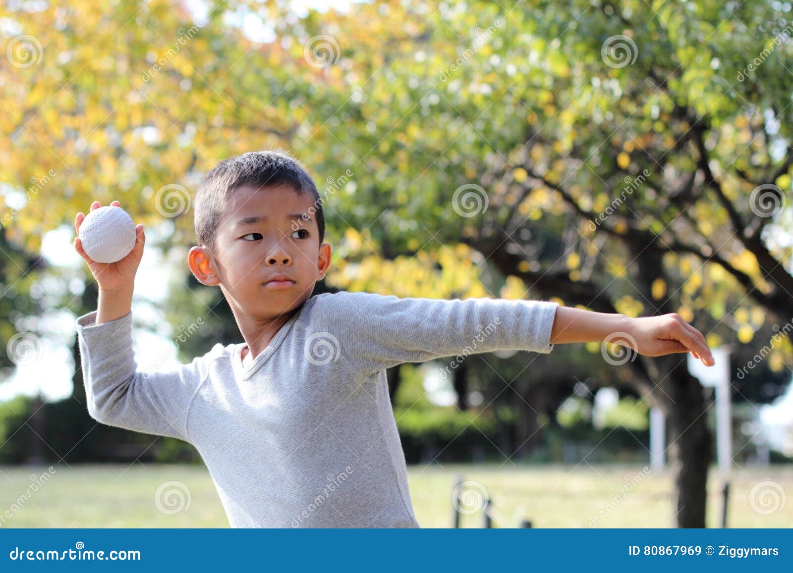 Japanese boy playing catch stock image. Image of lawn - 80867969