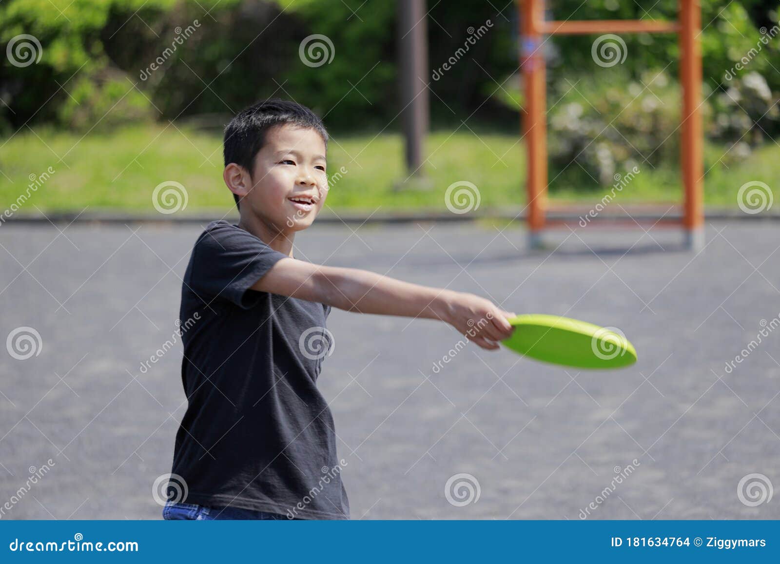 Japanese Boy Playing Flying Disc Stock Photo - Image of elementary ...