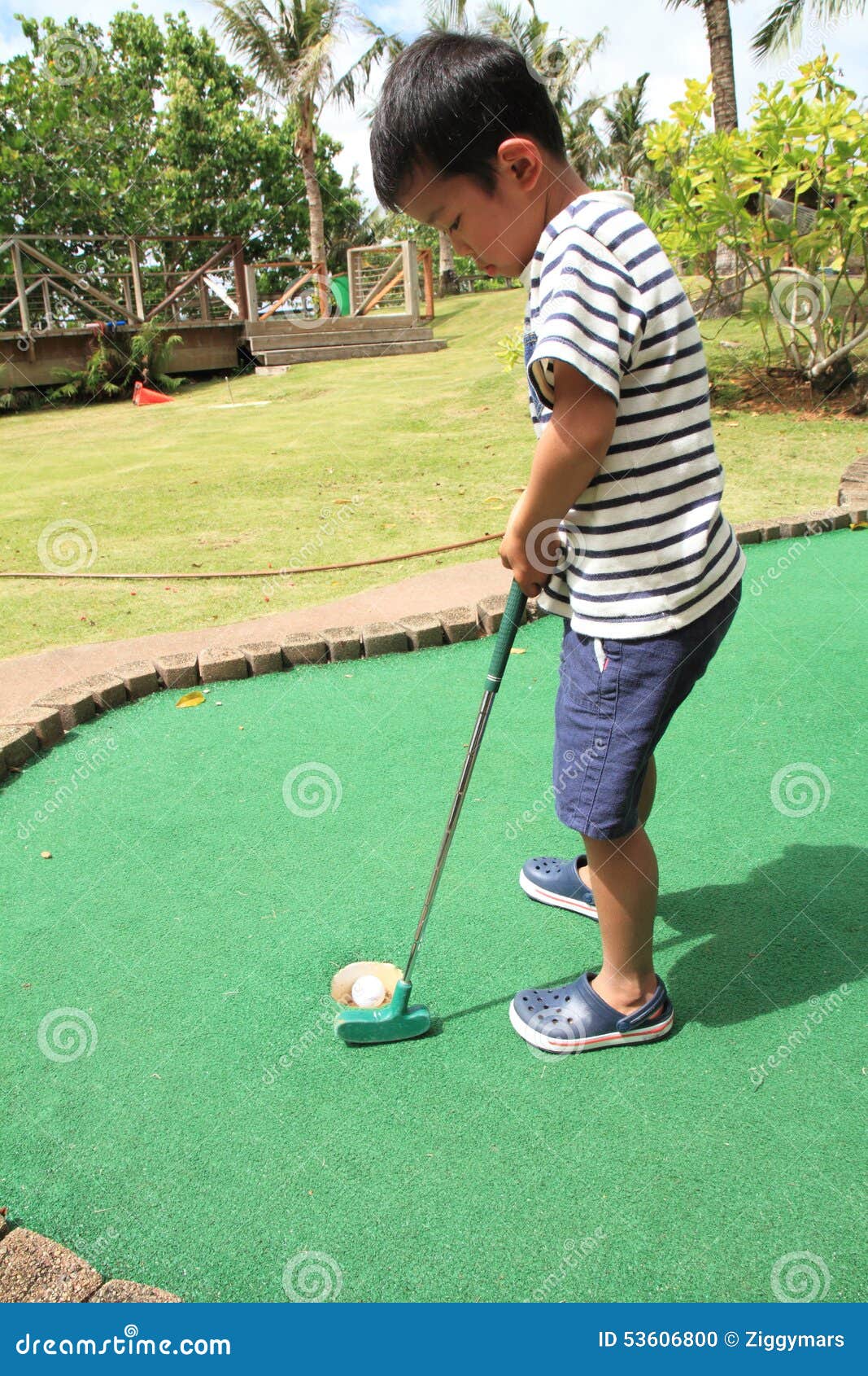 Japanese Boy Playing with Putting Golf Stock Photo - Image of face ...