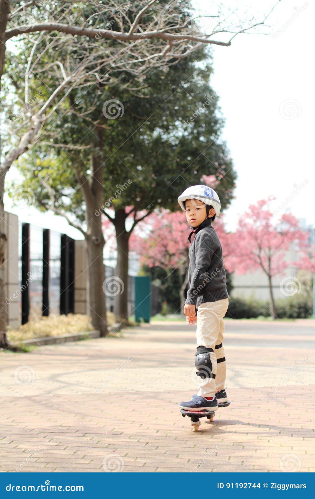 Japanese Boy Riding on a Casterboard Stock Photo - Image of pupil ...