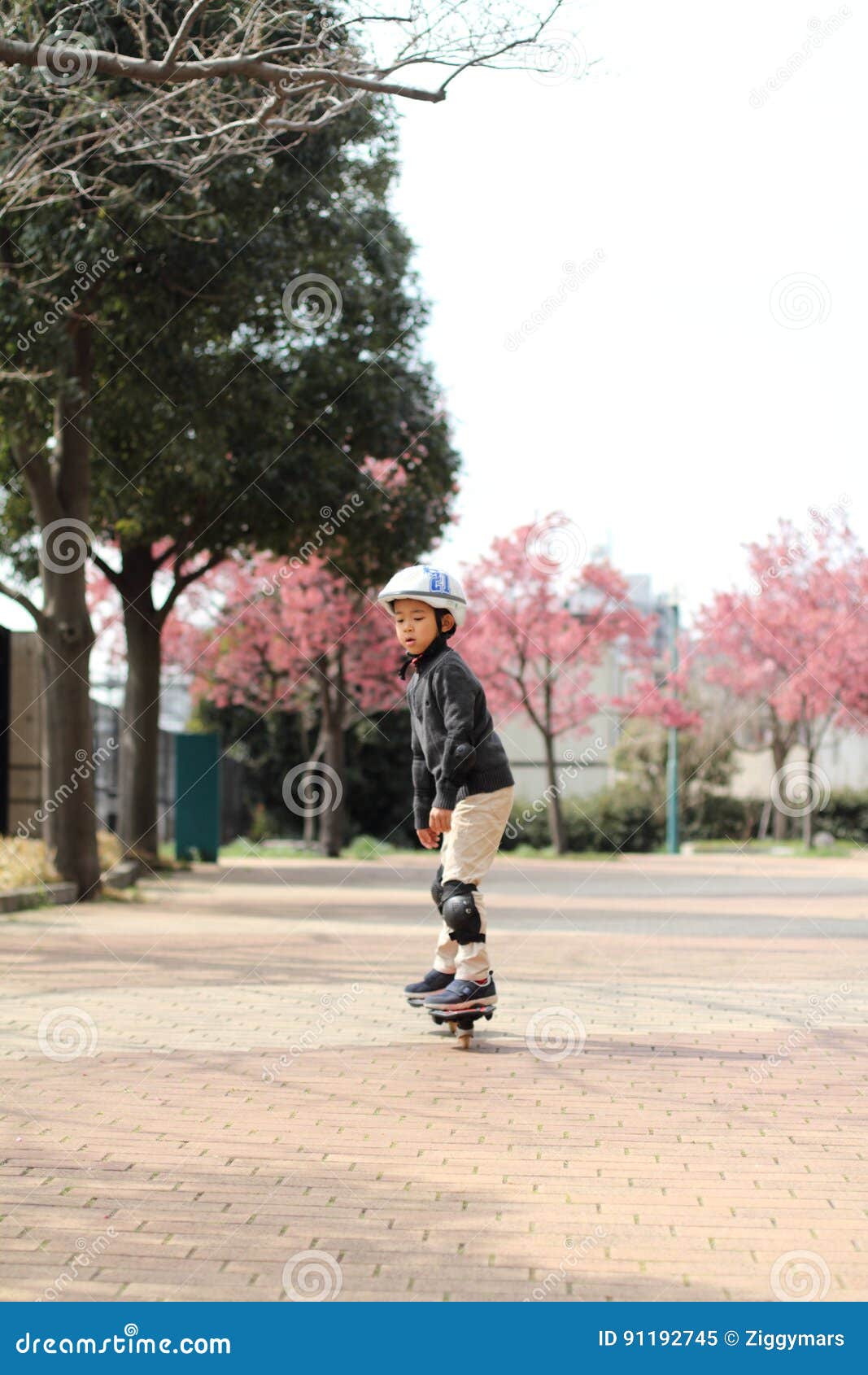 Japanese Boy Riding on a Casterboard Stock Image - Image of person ...