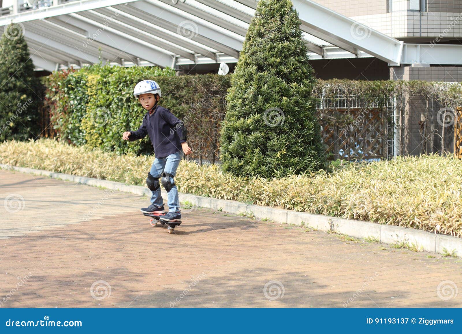 Japanese Boy Riding on a Casterboard Stock Image - Image of blue ...