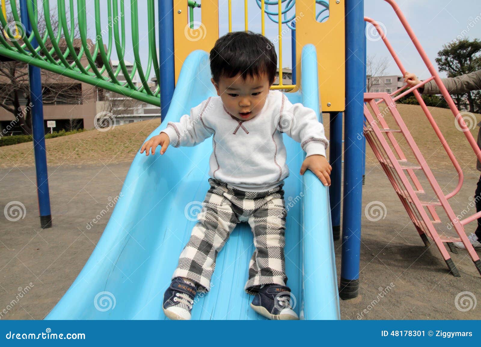 Japanese boy on the slide stock image. Image of male - 48178301