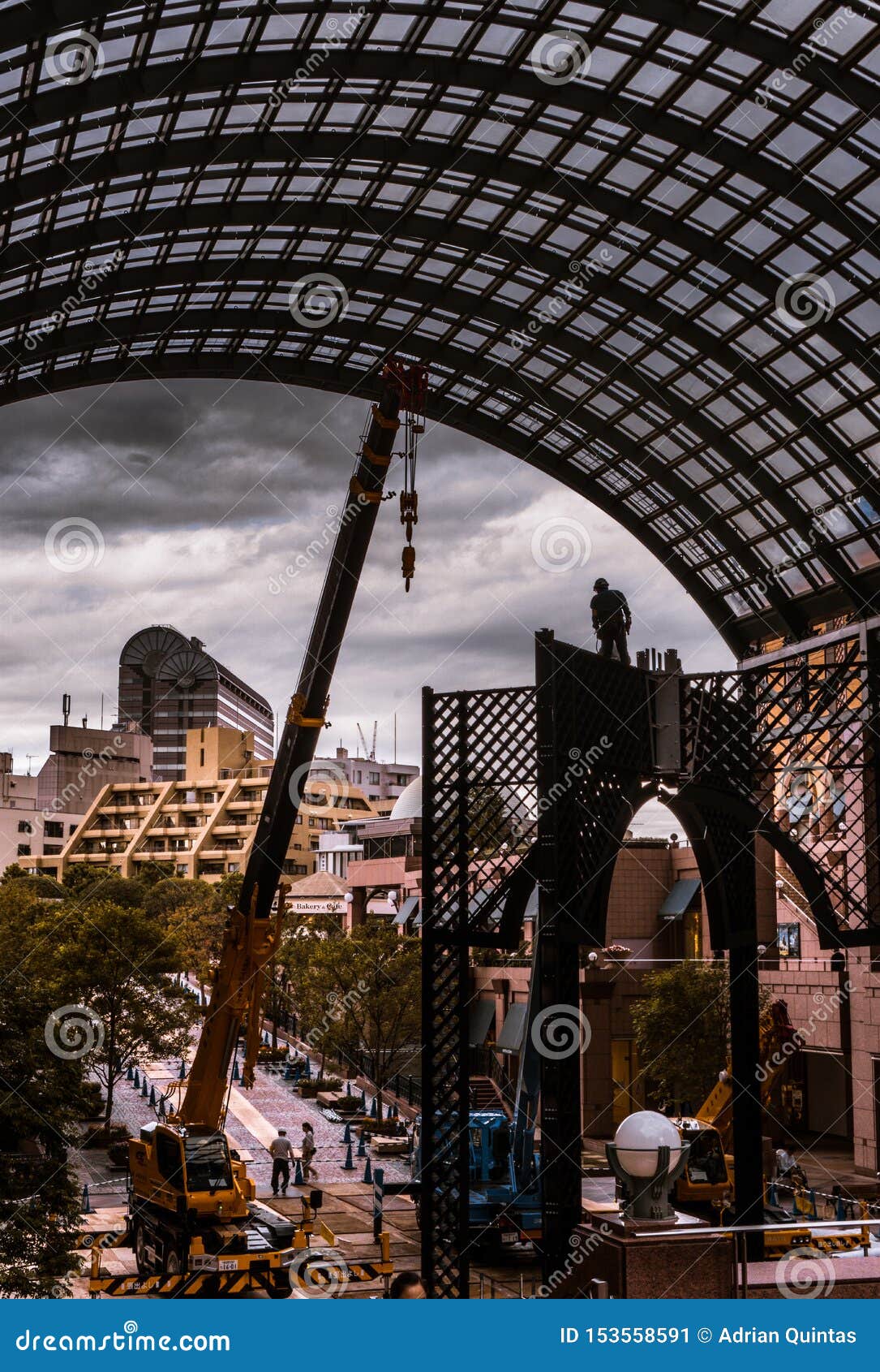 A Japanese Construction Site with Workers Operating Machines and ...