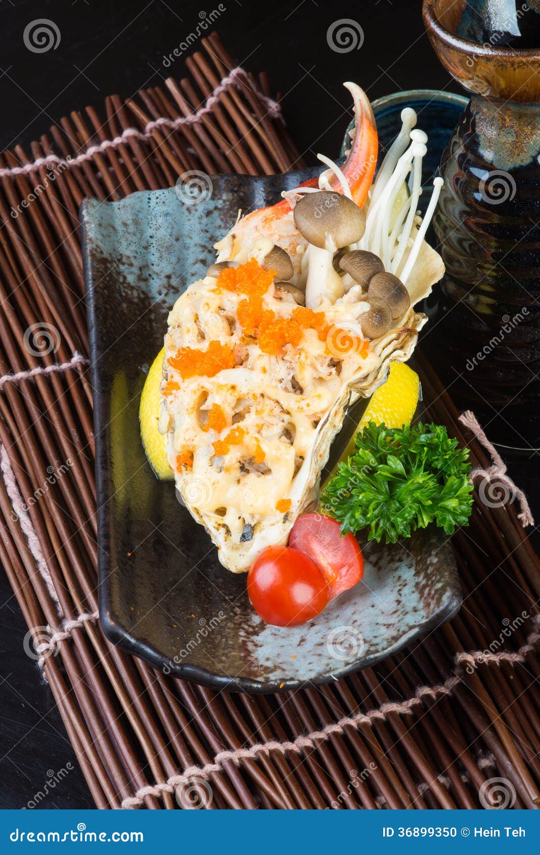 Japanese Cuisine. Grilled Shell Fish on the Background Stock Photo ...