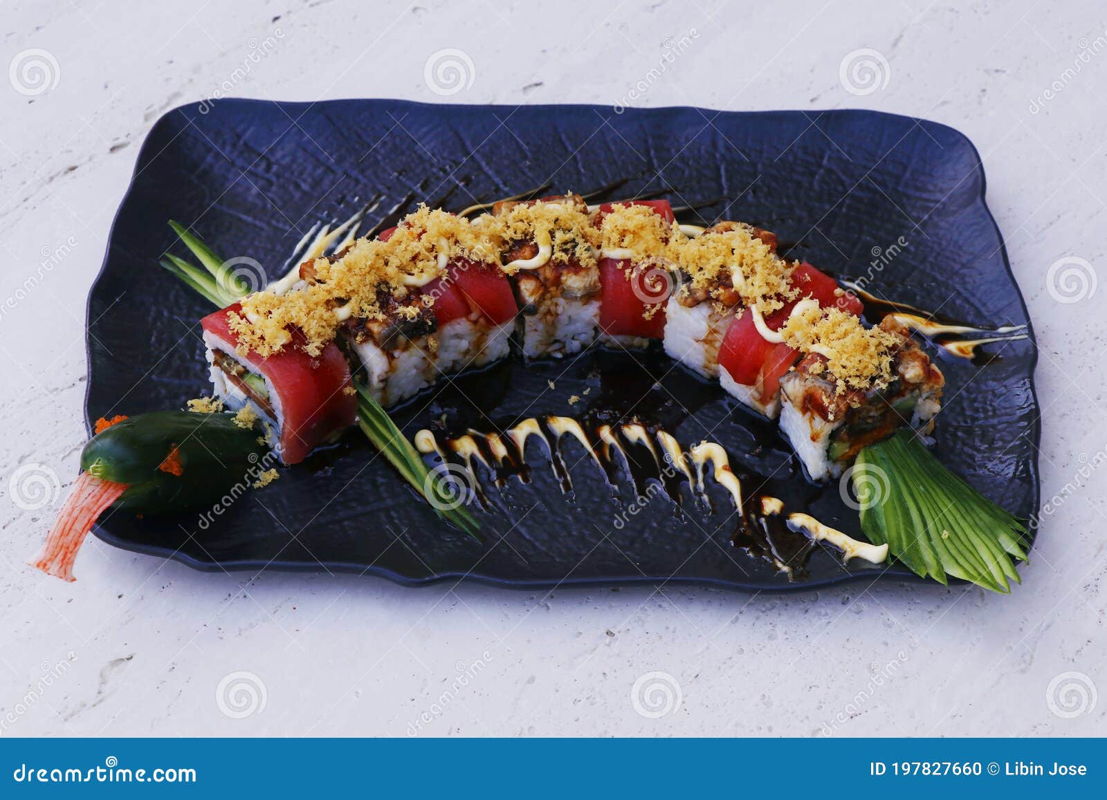 Japanese Dragon Sushi Rolls in a Black Plate Stock Photo - Image of ...