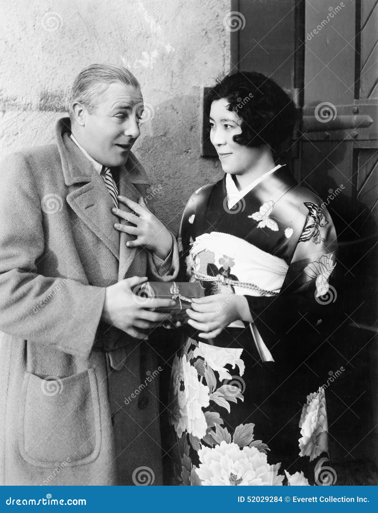 Japanese Woman Giving a Man a Present Stock Photo - Image of 2025 ...