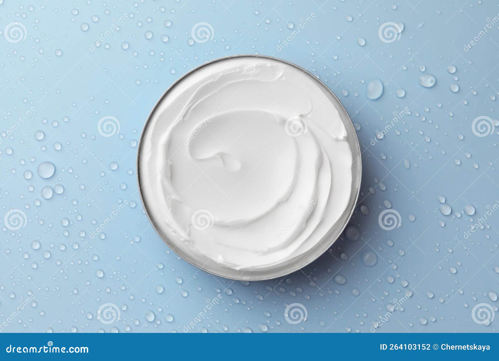 Jar of Face Cream on Light Blue Surface Covered with Water Drops, Top ...