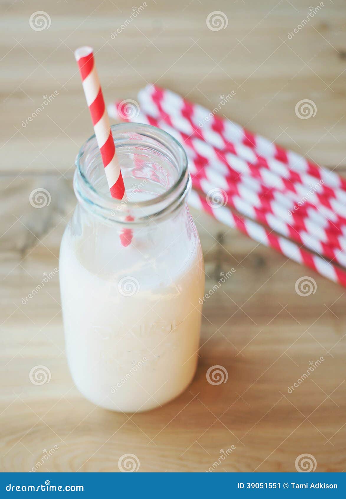 Jar of Milk with a Red and White Straw Stock Image - Image of milk ...