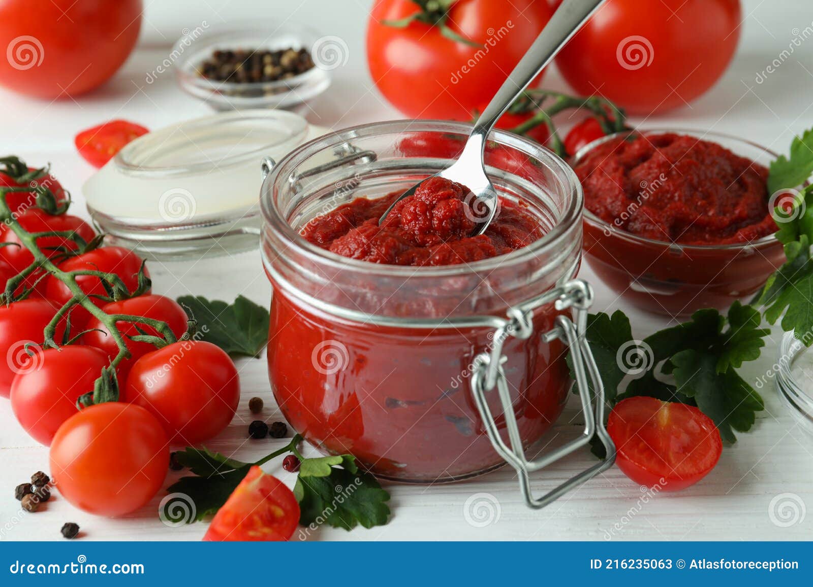 Jar and Spoon with Tomato Paste on White Wooden Table with Ingredients ...