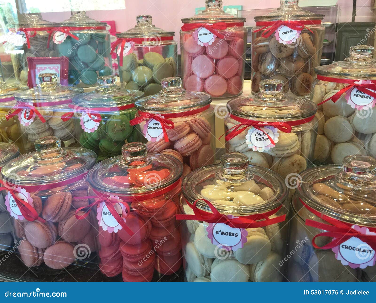 Jars of Colorful Macaroon Cakes on Display in Store Front Stock Photo ...