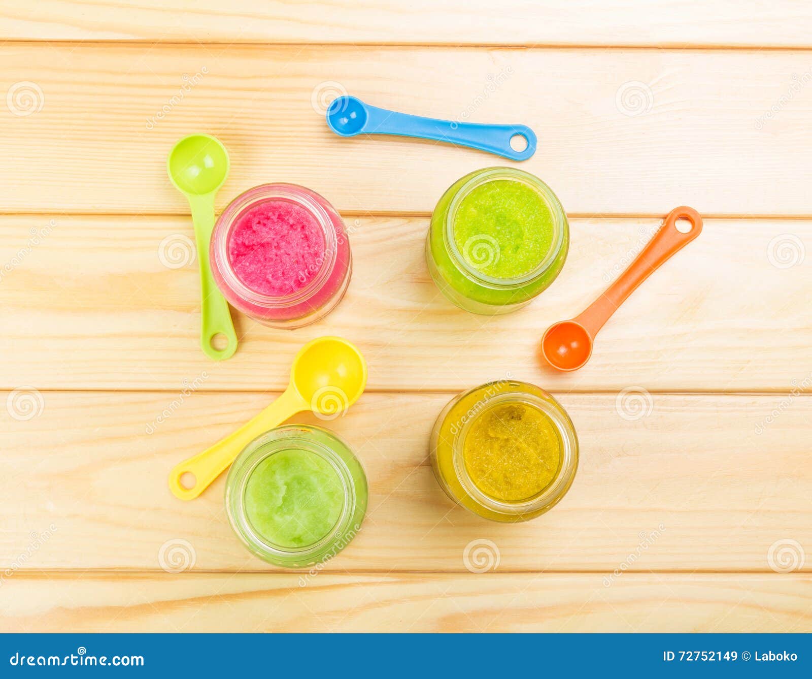 Jars of Different Baby Puree and Color Dimensional Spoon on Light Wood ...