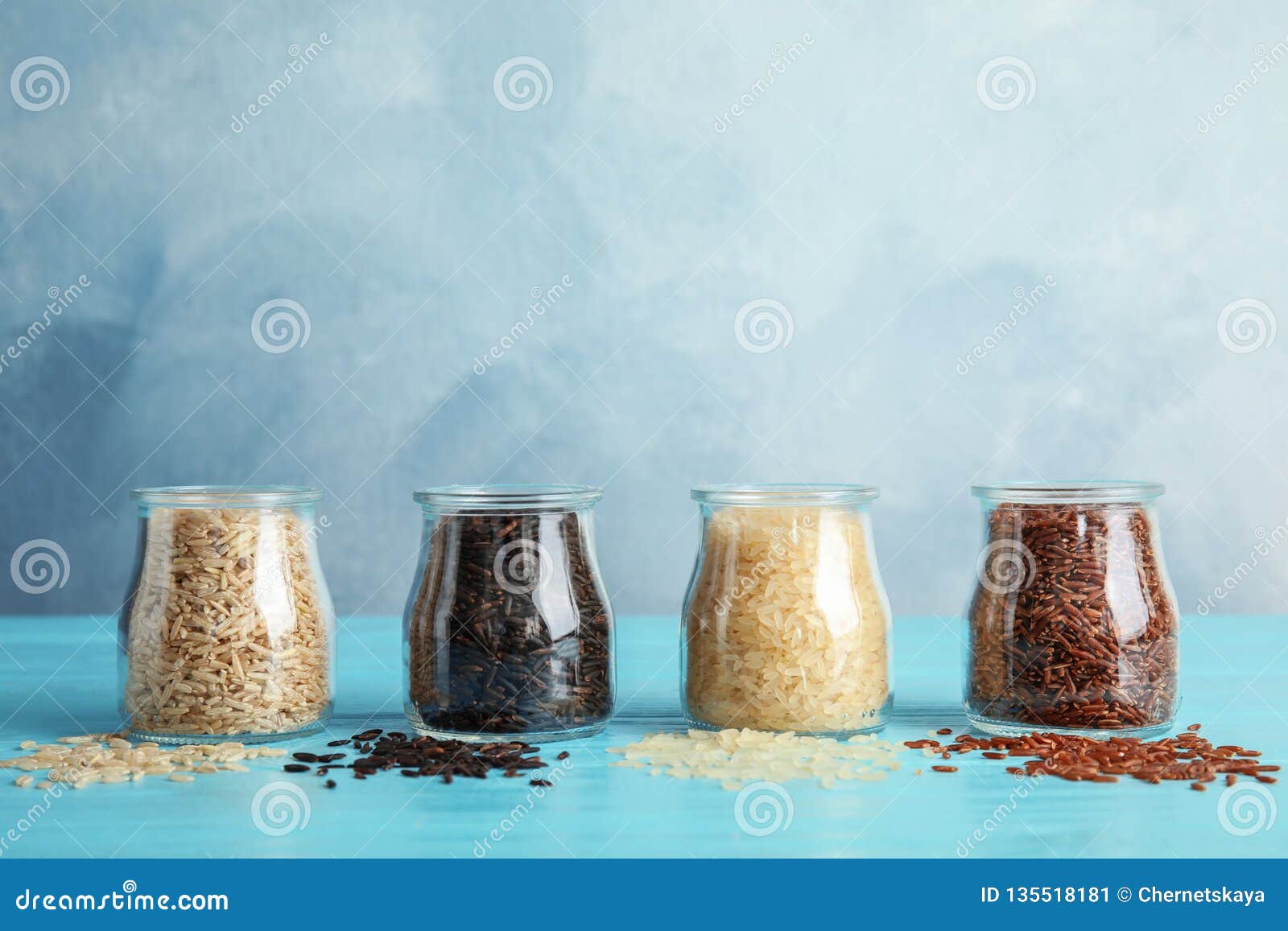 Jars With Different Types Of Organic Honey On Background Stock ...