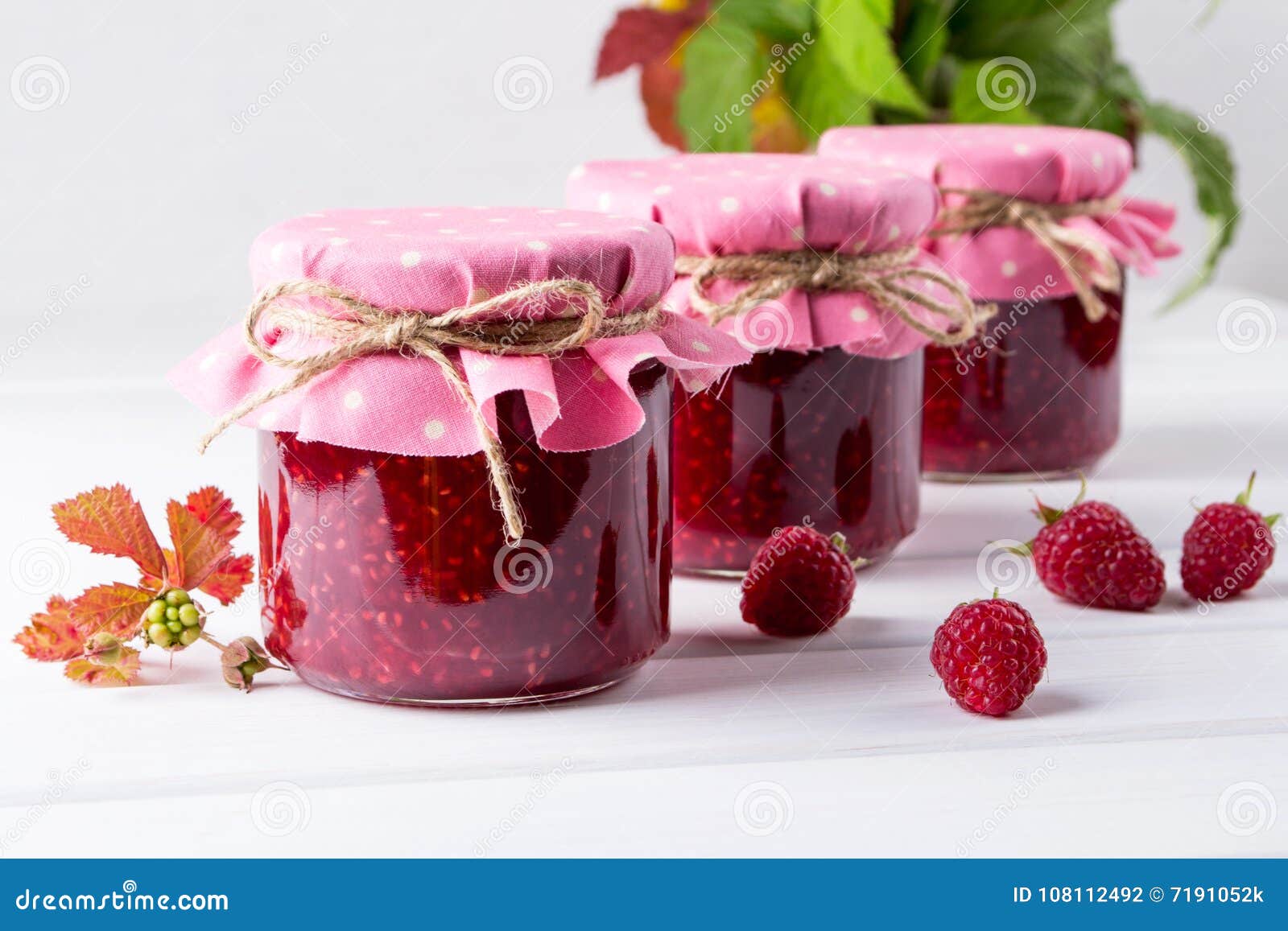 Jars with Raspberry Jam Placed in Rows and Fresh Raspberry Stock Photo ...