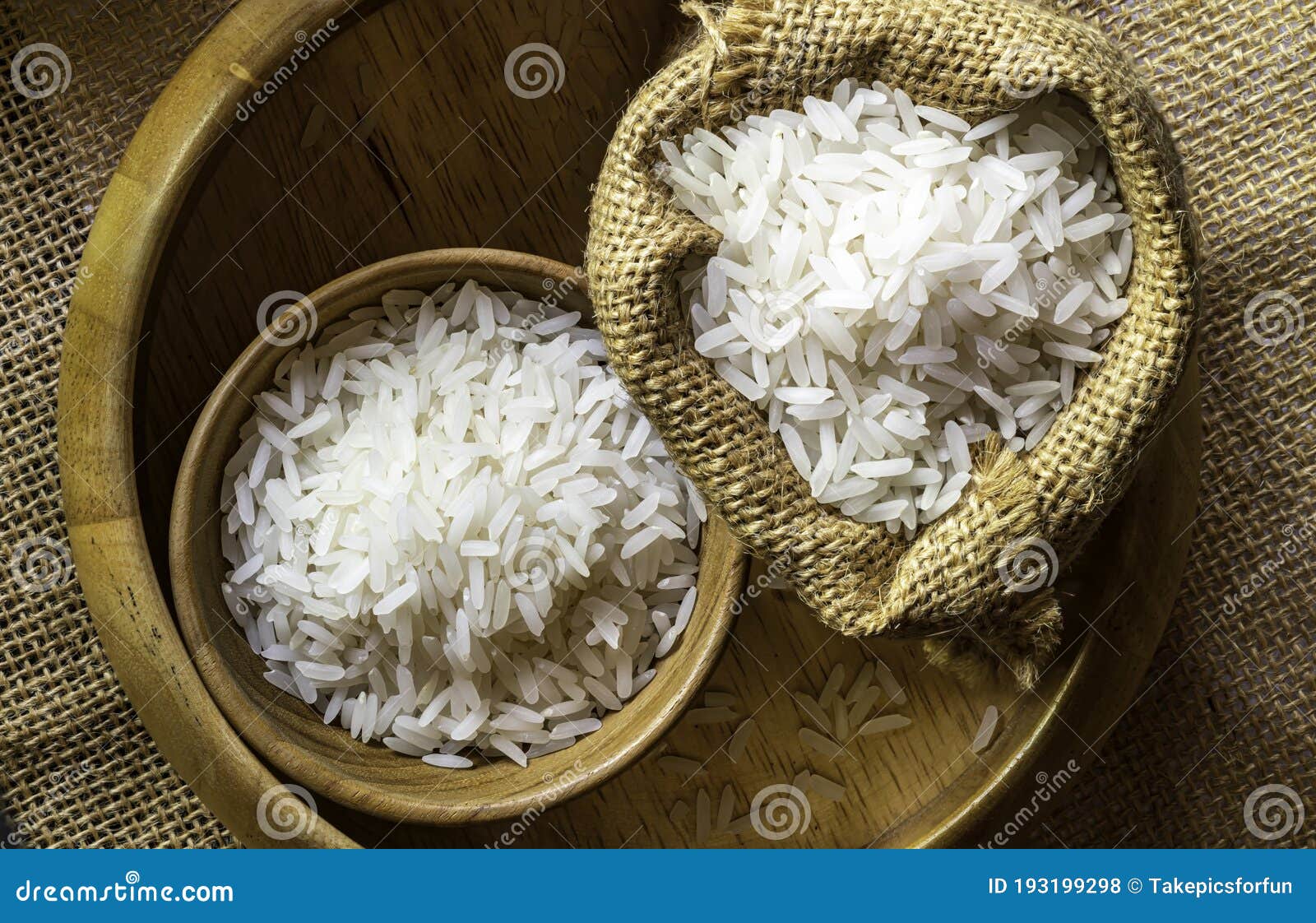 Jasmine Rice in a Sack and in a Wooden Bowl on a Table Stock Photo ...