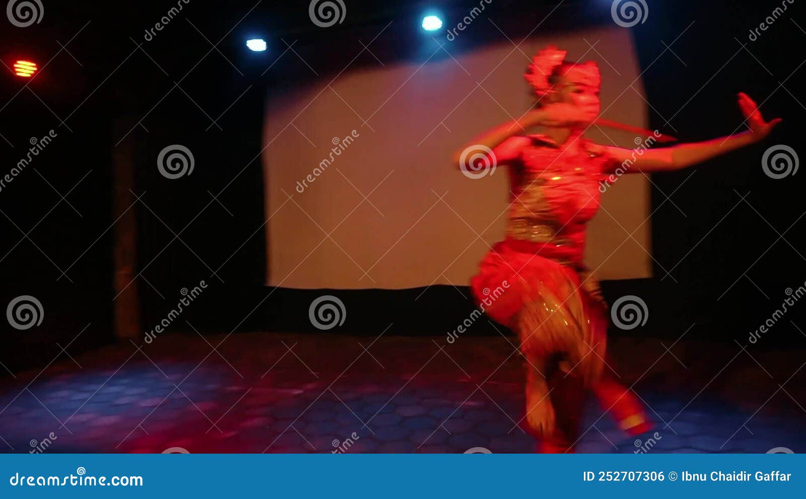 A Java Dancer Wearing a Traditional Costume while Dancing with the ...