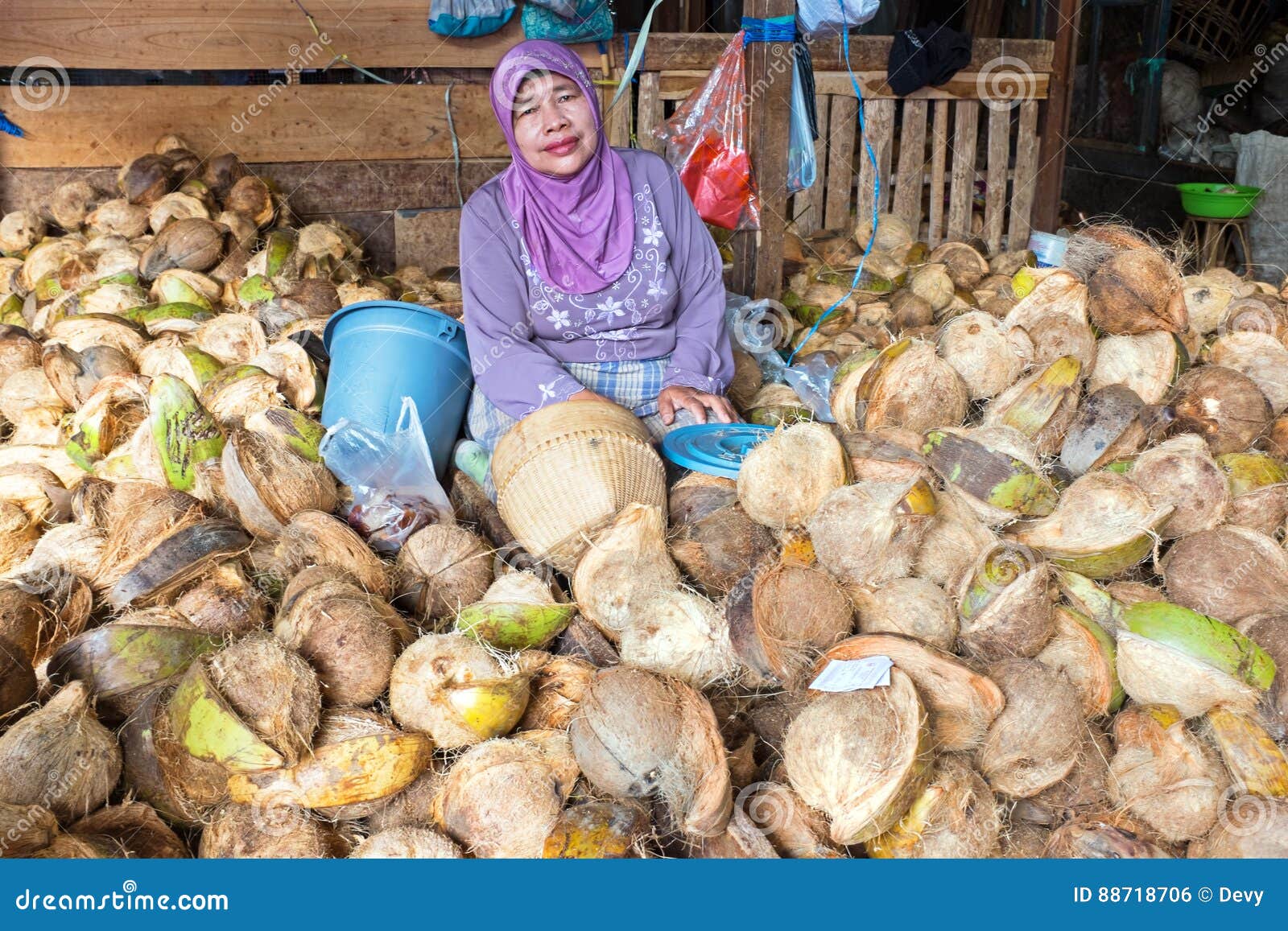 JAVA, INDONESIA - December 18 2016: Sales Woman Selling Coconuts ...