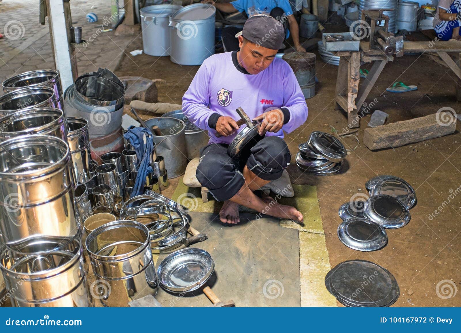 JAVA, INDONESIA - DECEMBER 21, 2016: Worker Making Kitchen Utensils in ...