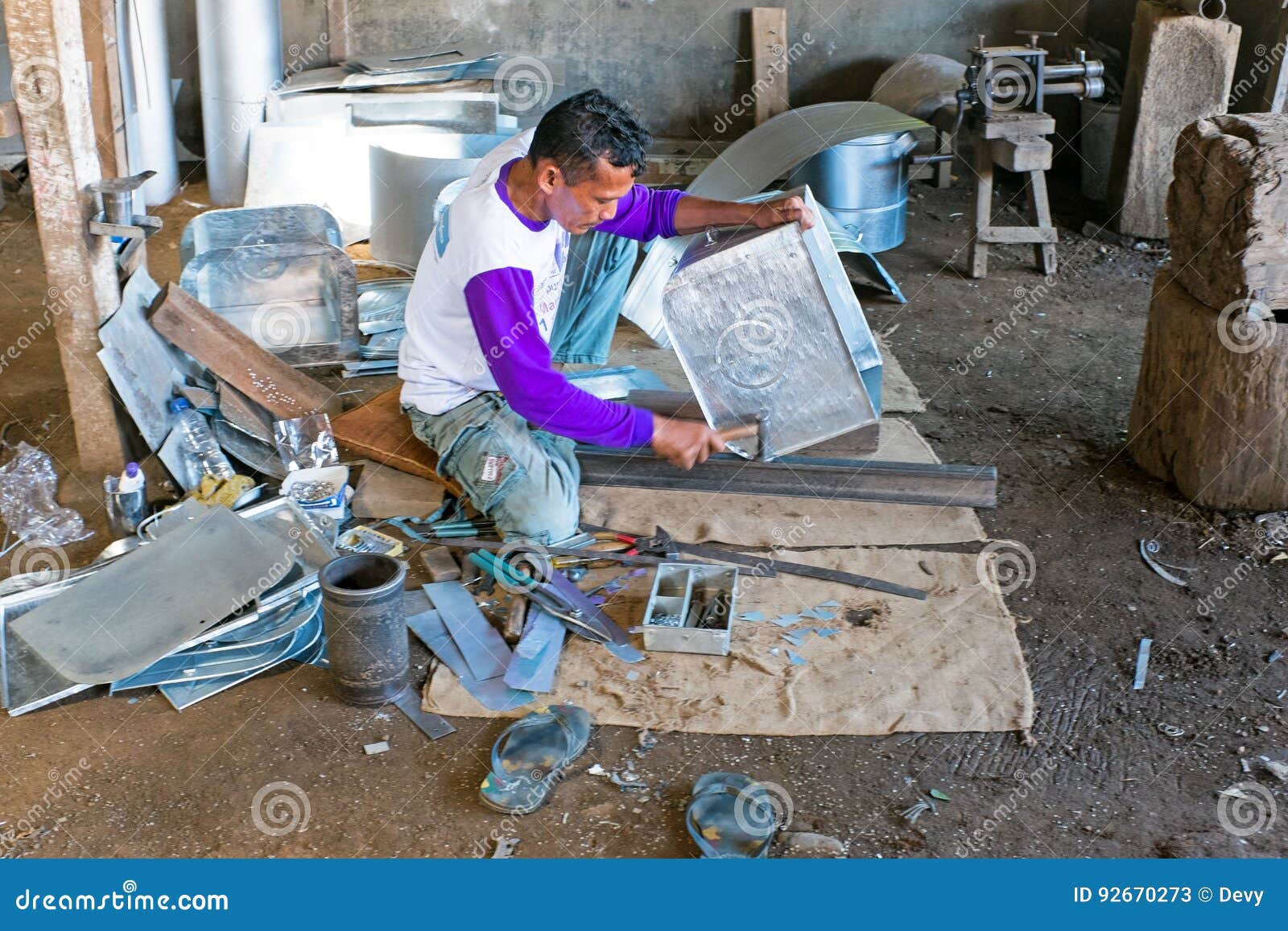 JAVA, INDONESIA - DECEMBER 21, 2016: Worker Making Kitchen Utensils in ...