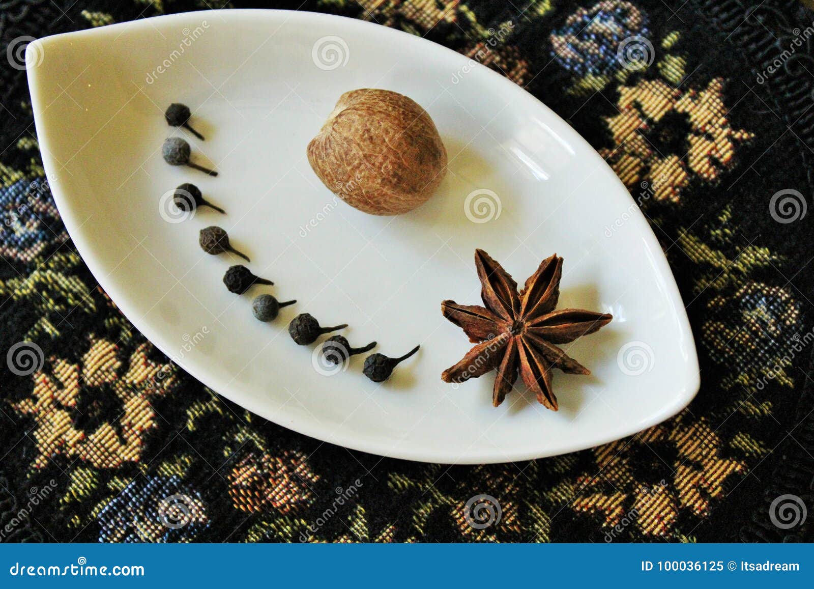 Java Pepper, Nutmeg and Star Anise on a Decorative Plate Stock Image ...