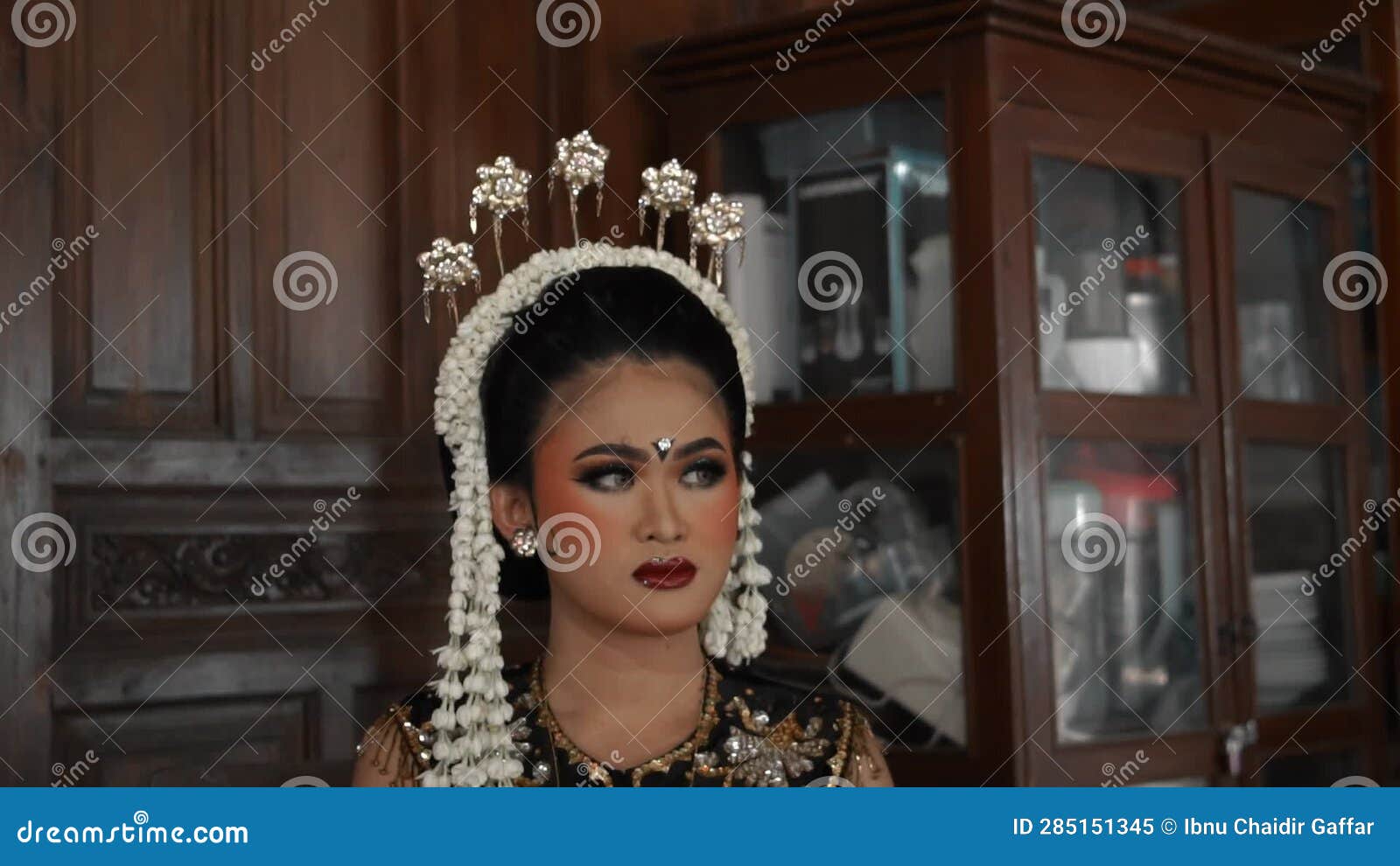 A Javanese Bride Wears Jasmine on Her Head and Makeup on Her Face Stock ...