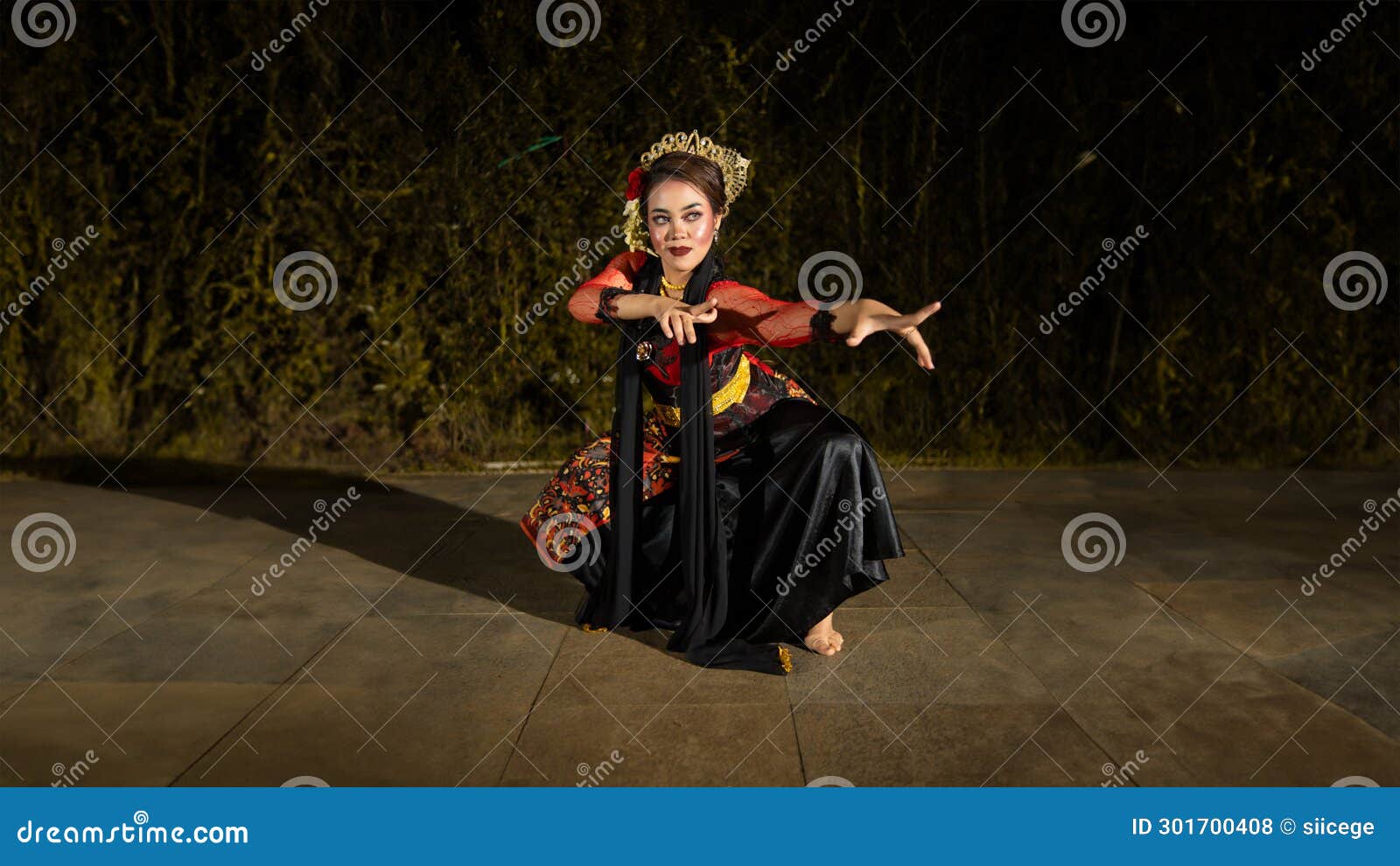 A Javanese Dancer in a Red Costume Presented a Dance that Captivated ...