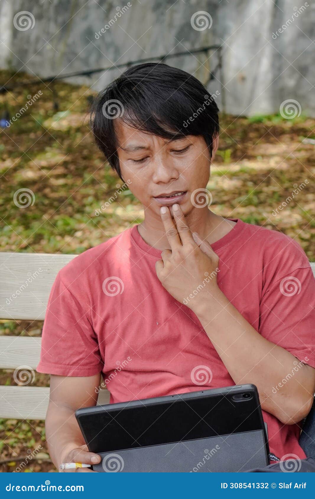 Javanese Man Thinking on a Park Bench. Stock Photo - Image of internet ...