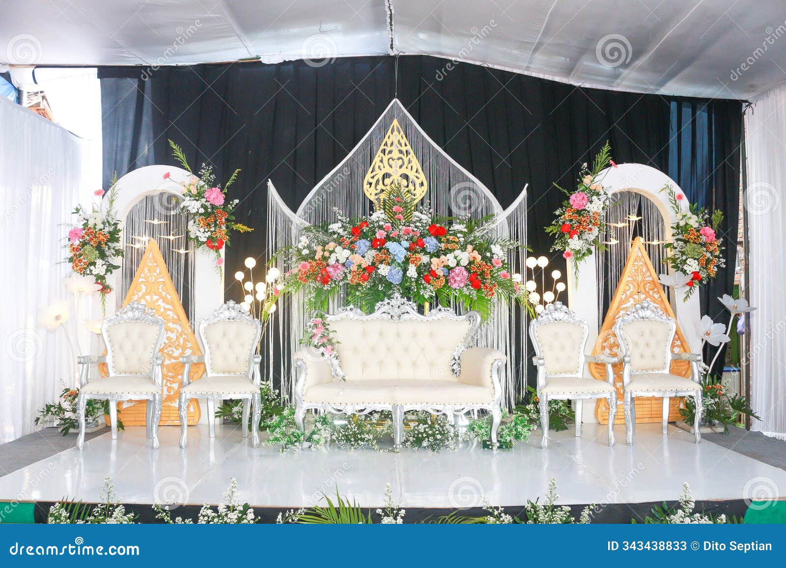 Javanese Traditional Wedding Stage with Flower Decorations and White ...
