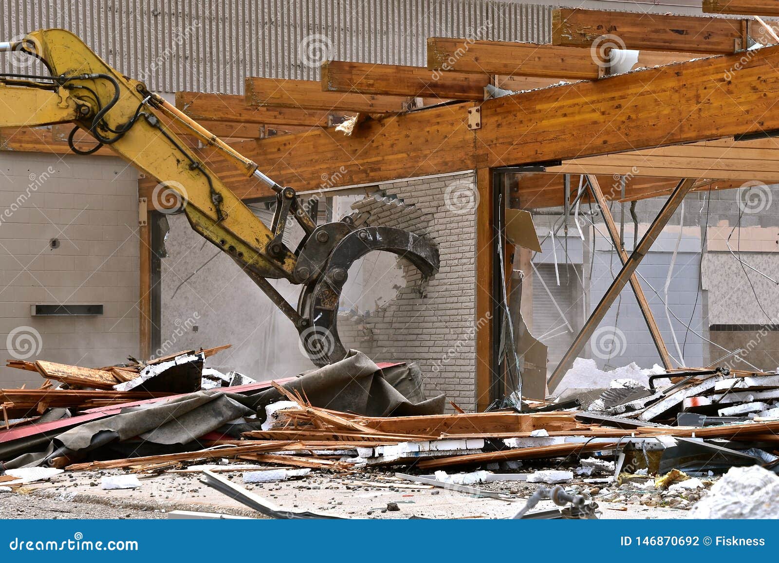 Jaws of an Excavating Machine Destroy a Brick Wall Stock Photo - Image ...