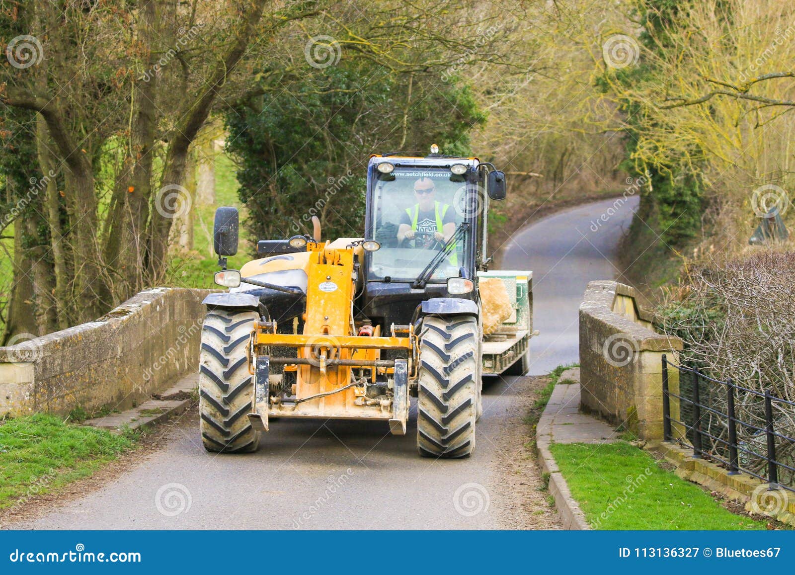 Jcb Loader Pulling Trailer Over a Bridge Editorial Photography - Image ...