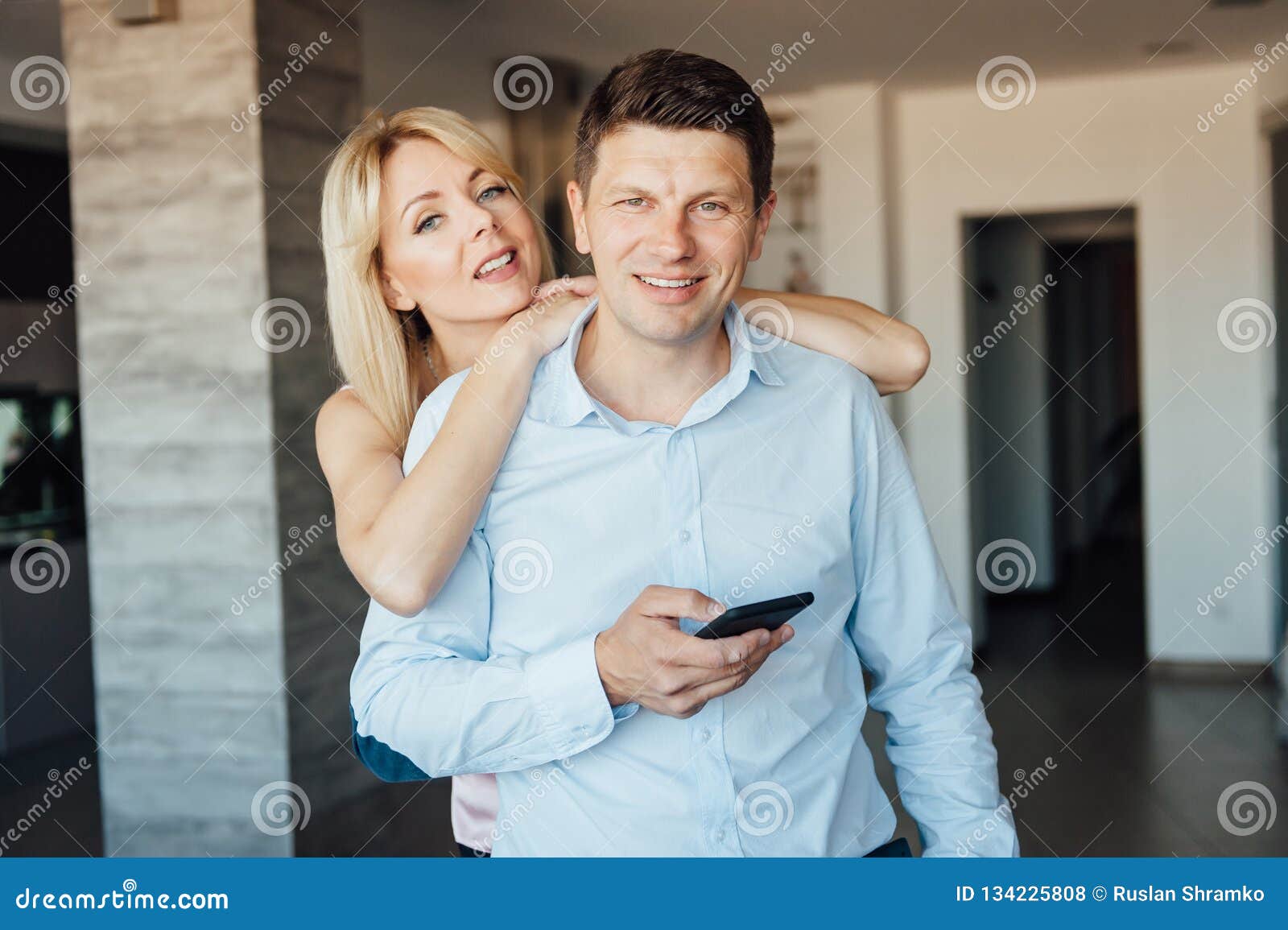 Jealous Woman Looking at Her Partner Chatting on the Phone Stock Photo ...