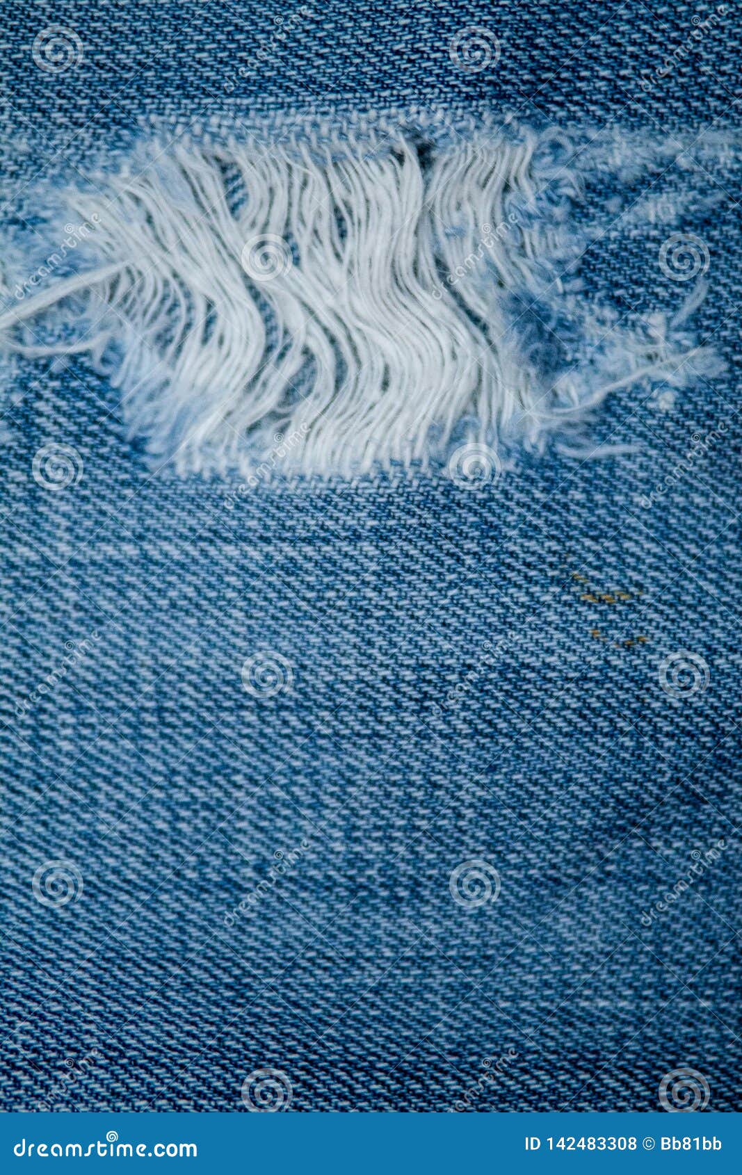 Blue Jean Texture with a Hole and Threads Stock Photo - Image of ...