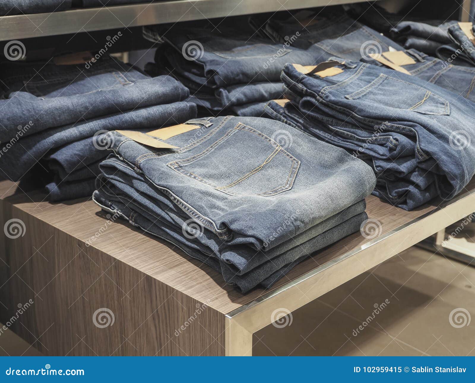 Jeans on the Counter in the Store. Stock Image - Image of jeans, rack ...