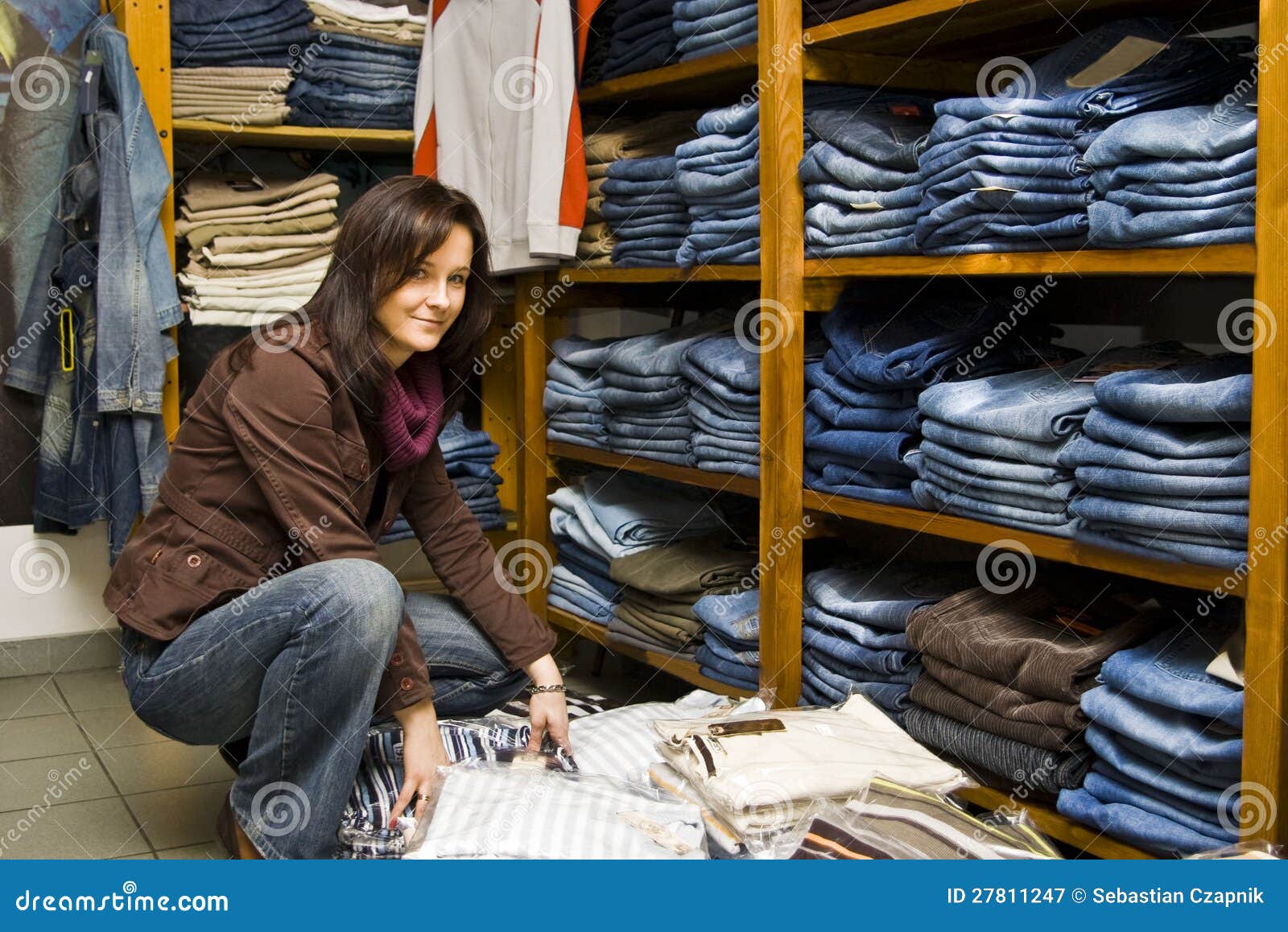 Jeans shop woman stock image. Image of salesperson, arranging - 27811247
