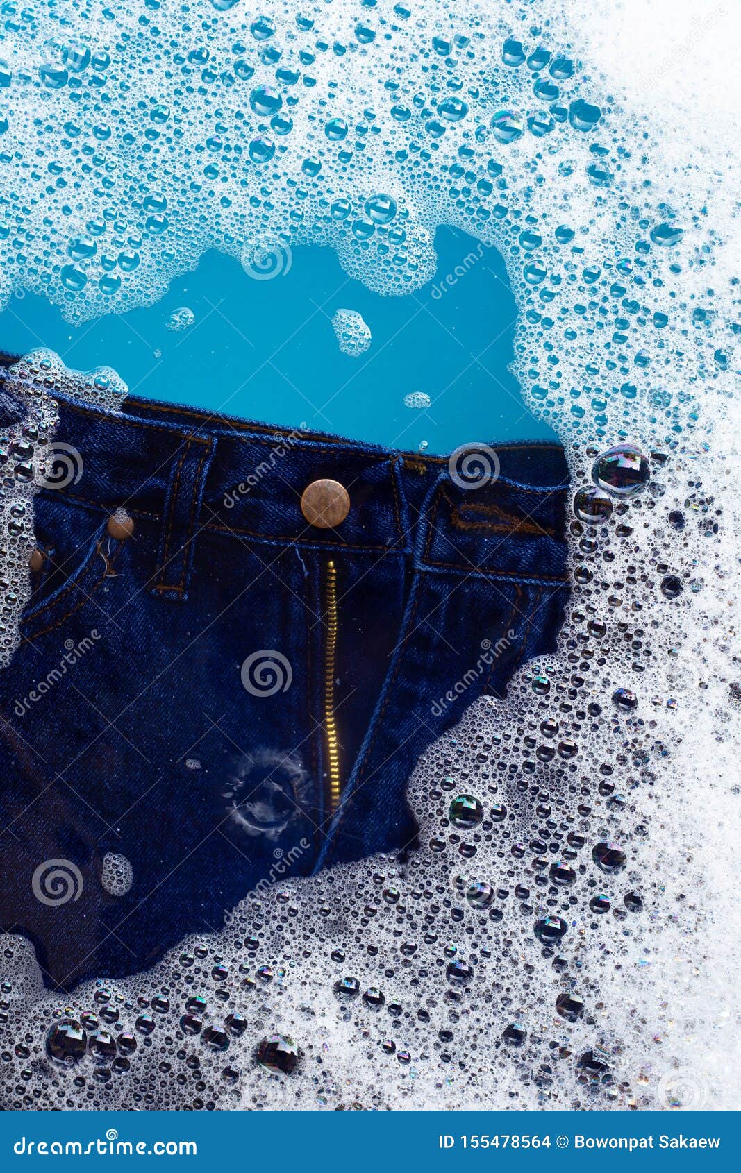 Jeans Soak in Powder Detergent Water Dissolution. Laundry Concept Stock ...
