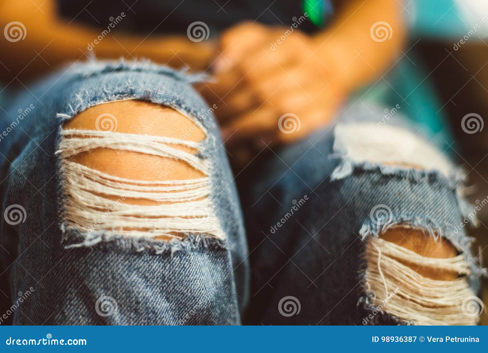 Jeans torn at the knee stock image. Image of closeup - 98936387