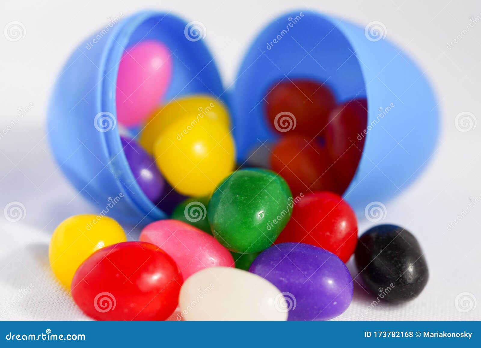 Jelly Beans Spill Out of a Plastic Easter Egg Stock Photo - Image of ...