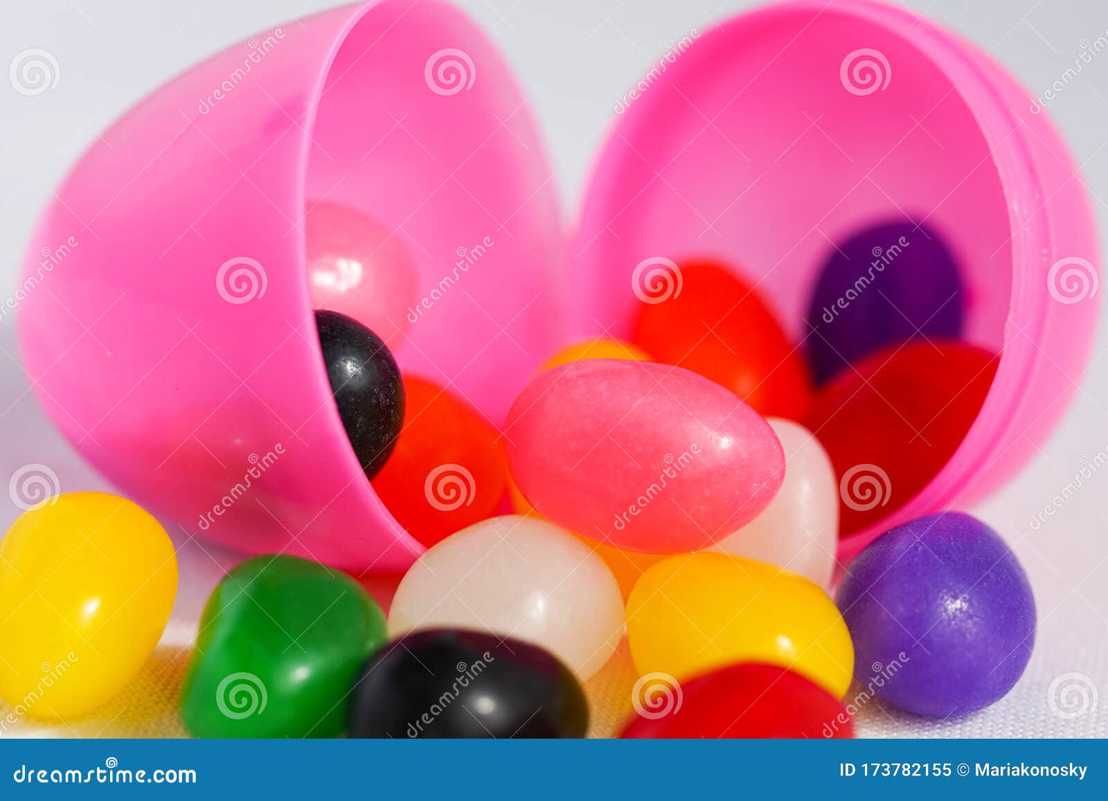 Jelly Beans Spill Out of a Plastic Easter Egg Stock Image - Image of ...