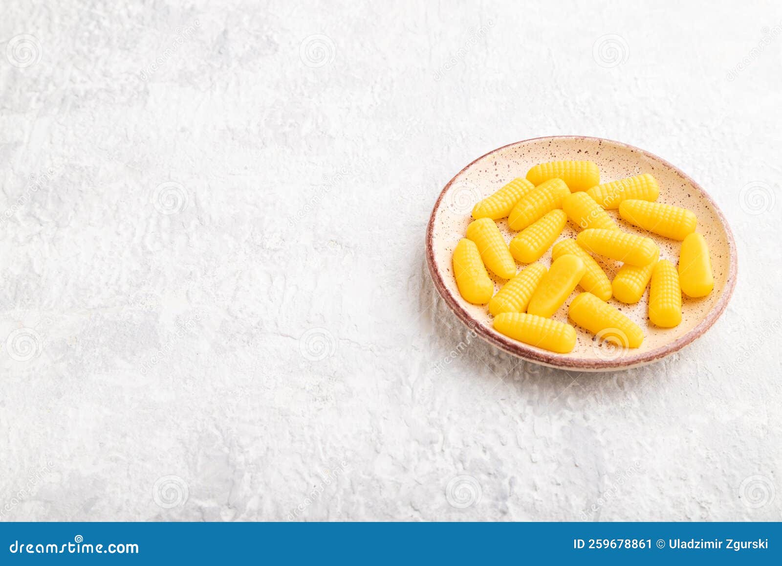 Jelly Corn Candies on Gray Concrete Background. Copy Space, Side View ...