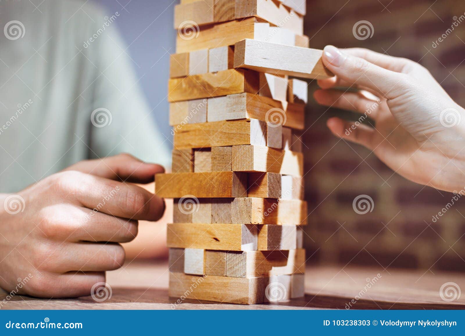 The Jenga Game stock image. Image of indoors, laughing - 103238303