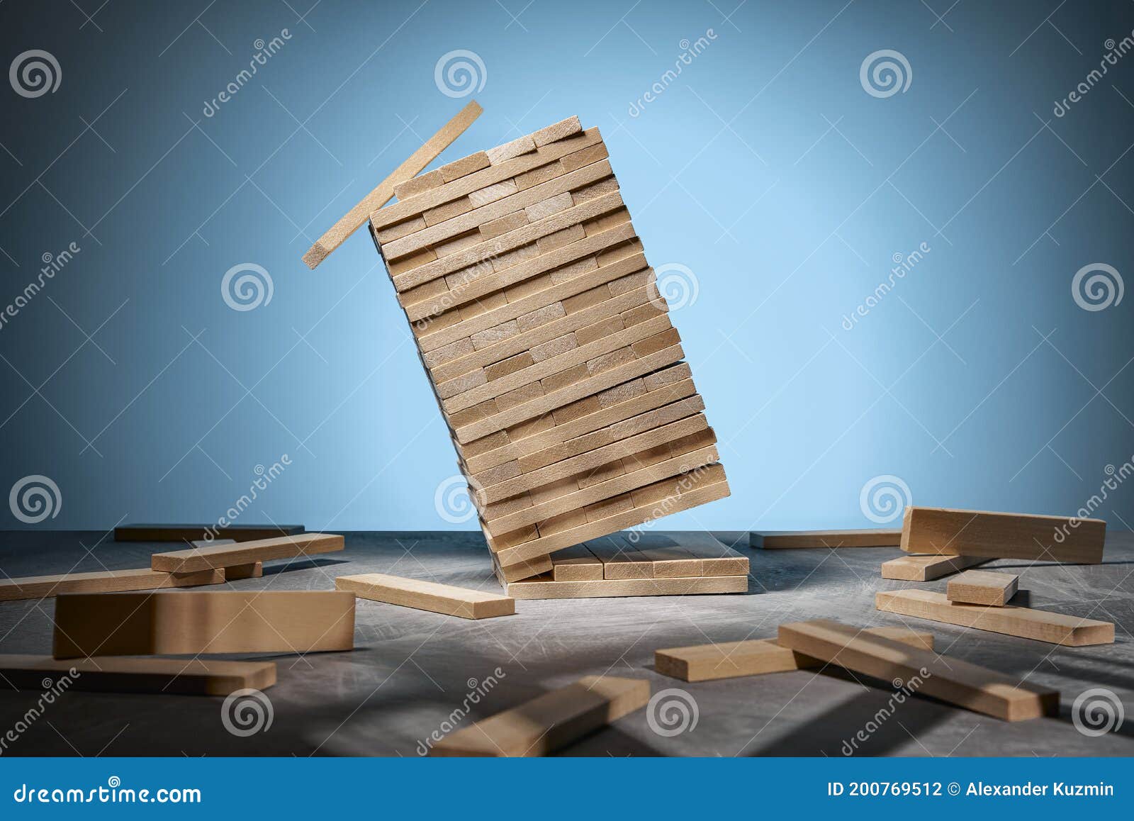 Jenga Game, a Falling Tower of Wooden Blocks on a Blue Background and ...