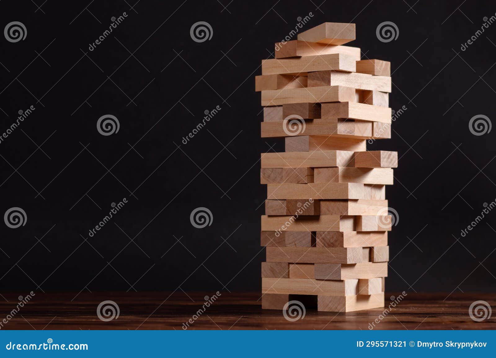 Jenga Tower Made of Wooden Blocks on Dark Background Stock Image ...