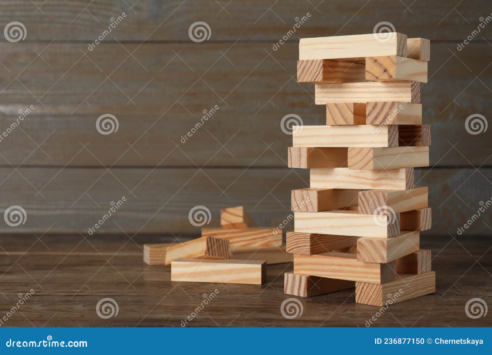 Jenga Tower Made of Wooden Blocks on Table, Space for Text Stock Photo ...
