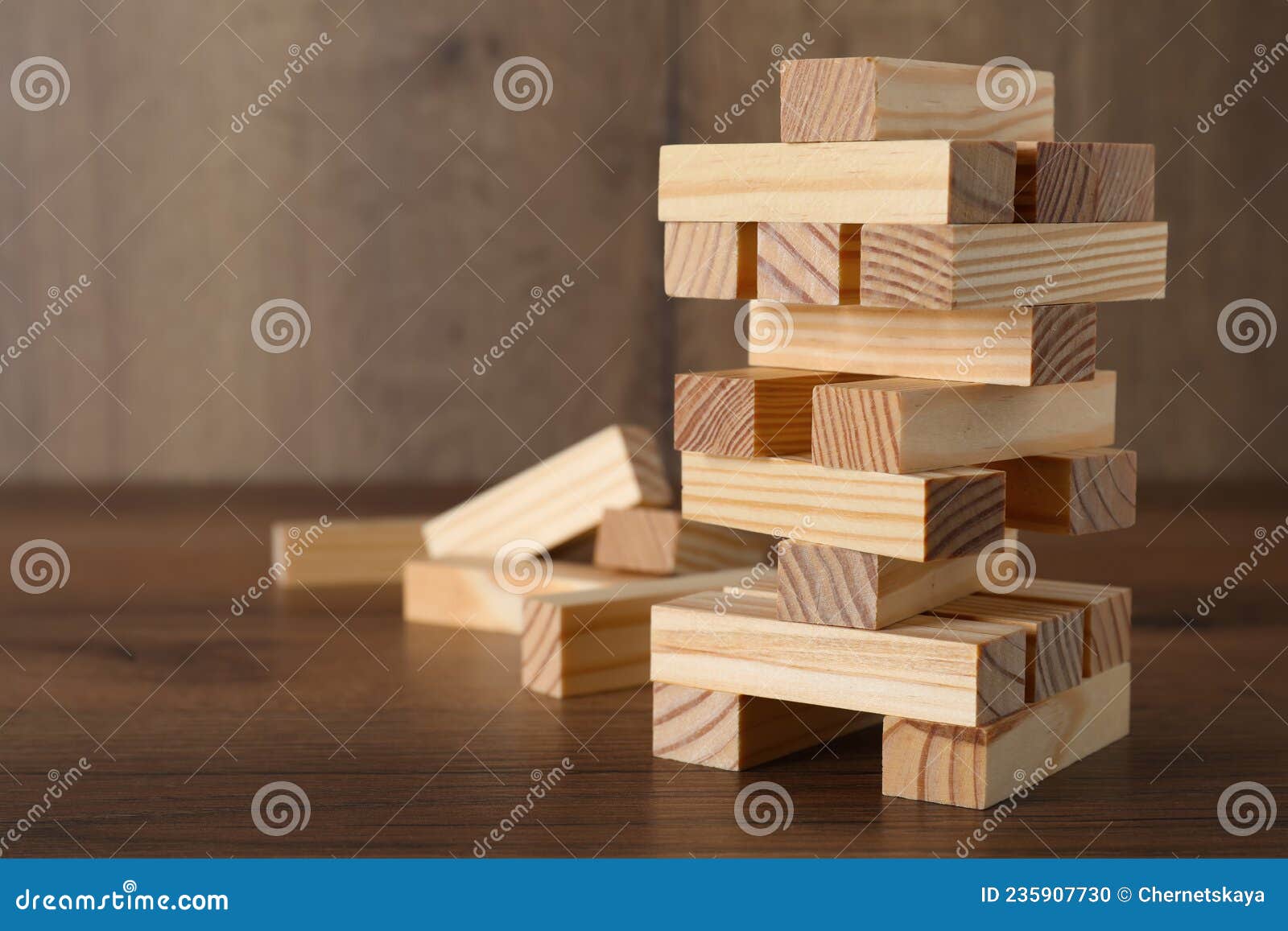 Jenga Tower and Wooden Blocks on Table, Space for Text Stock Photo ...